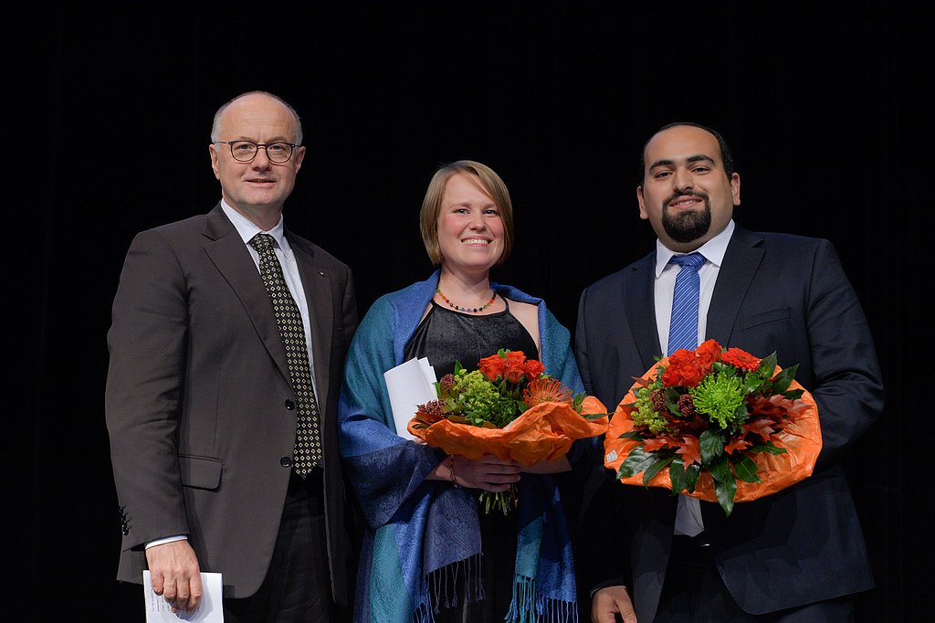 ECM graduates Lea Treick and Ramiz Haidar Salim Qussous hold this year ...